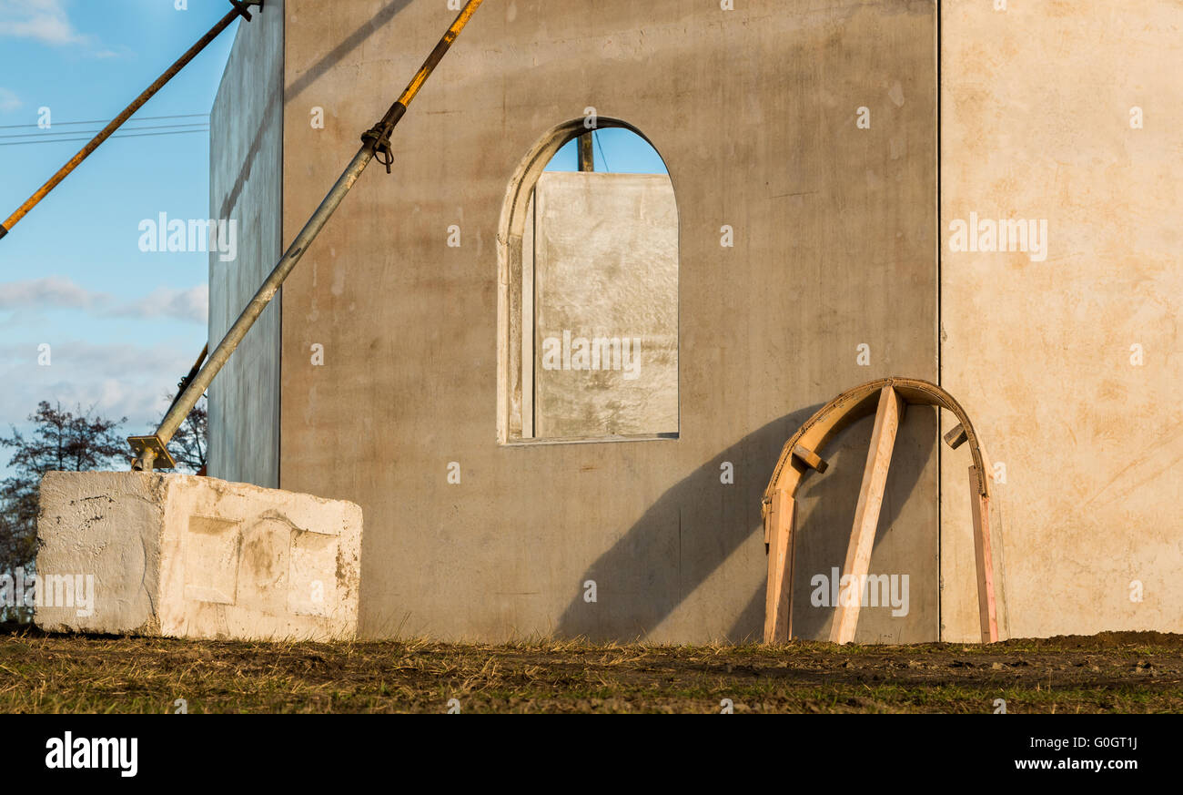 Cement wall with a arch window hole in it Stock Photo - Alamy