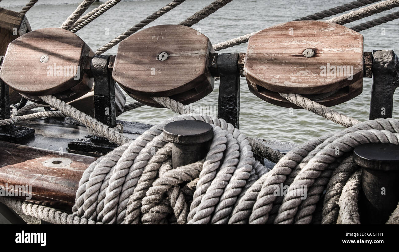 Blocks and rigging at the old sailboat, close-up Stock Photo - Alamy