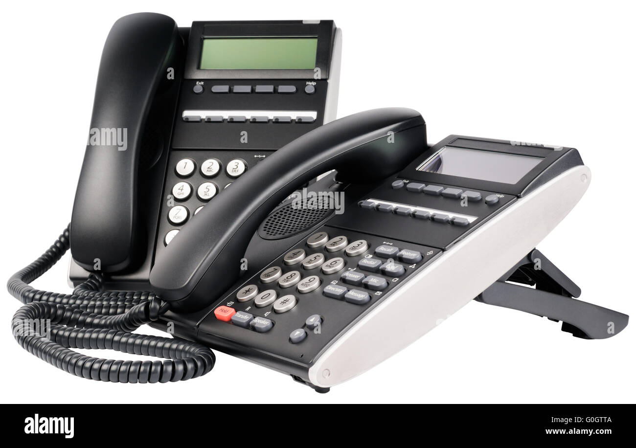 Two office digital multi-button telephone sets with LCD isolated on ...