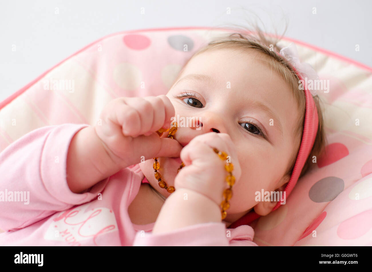 teething baby girl Stock Photo - Alamy