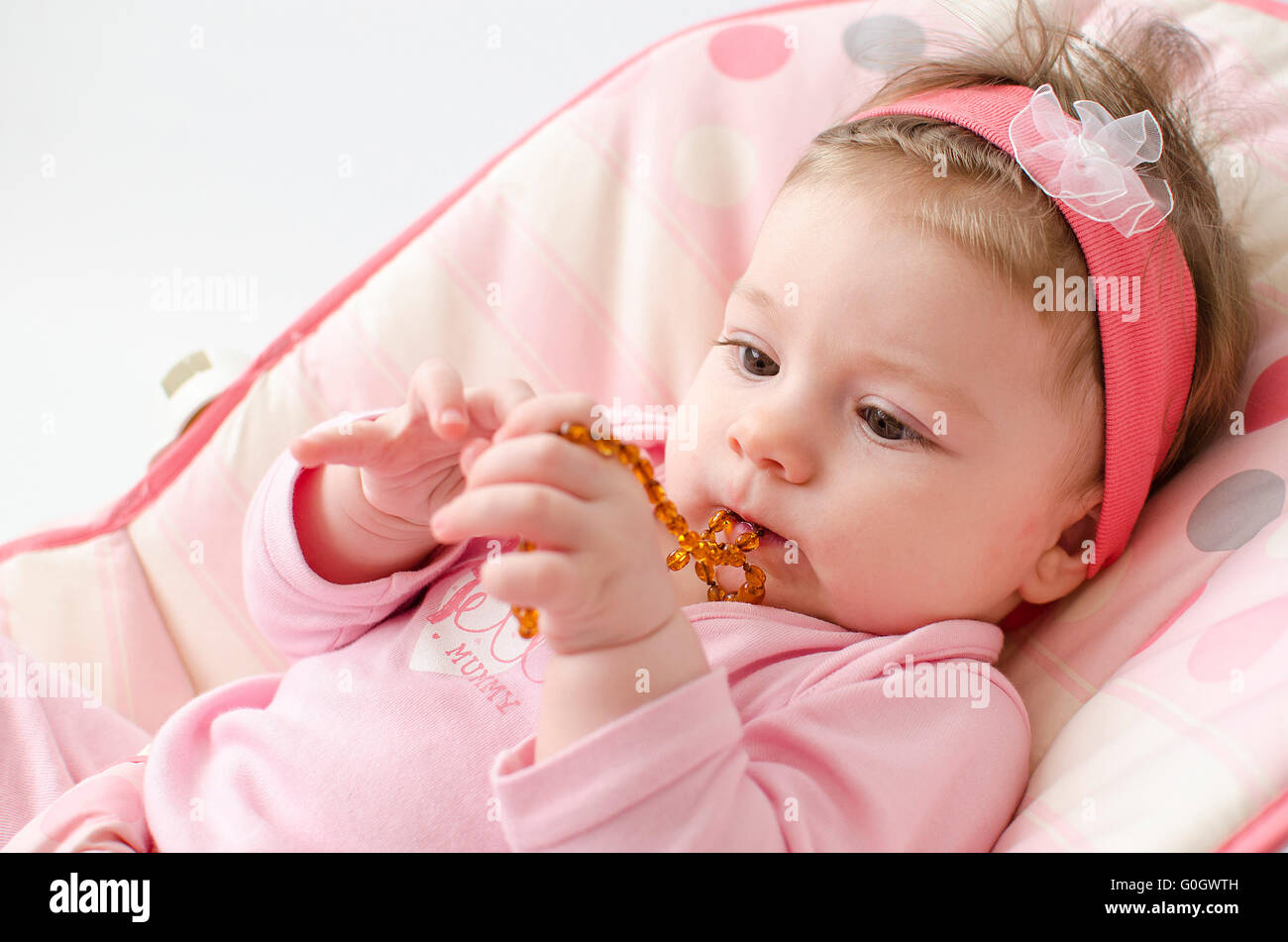 teething baby girl Stock Photo - Alamy
