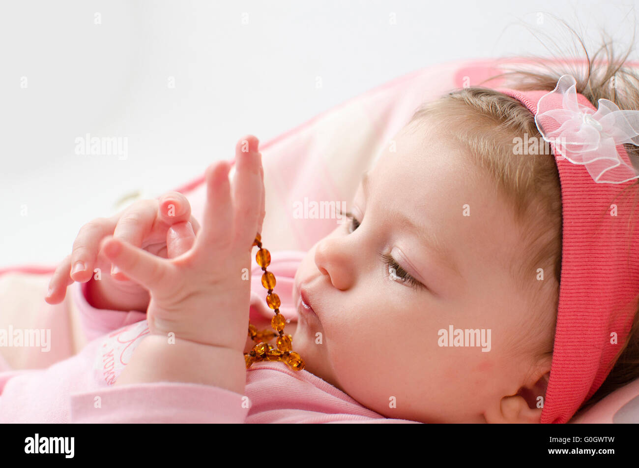 teething baby girl Stock Photo - Alamy