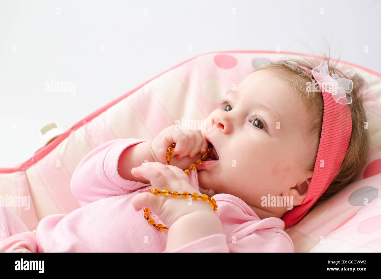 teething baby girl Stock Photo - Alamy