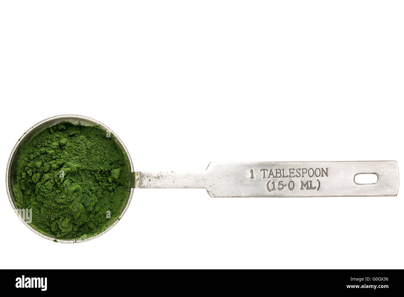 Nutrient-rich organic spirulina powder - isolated measuring metal ...