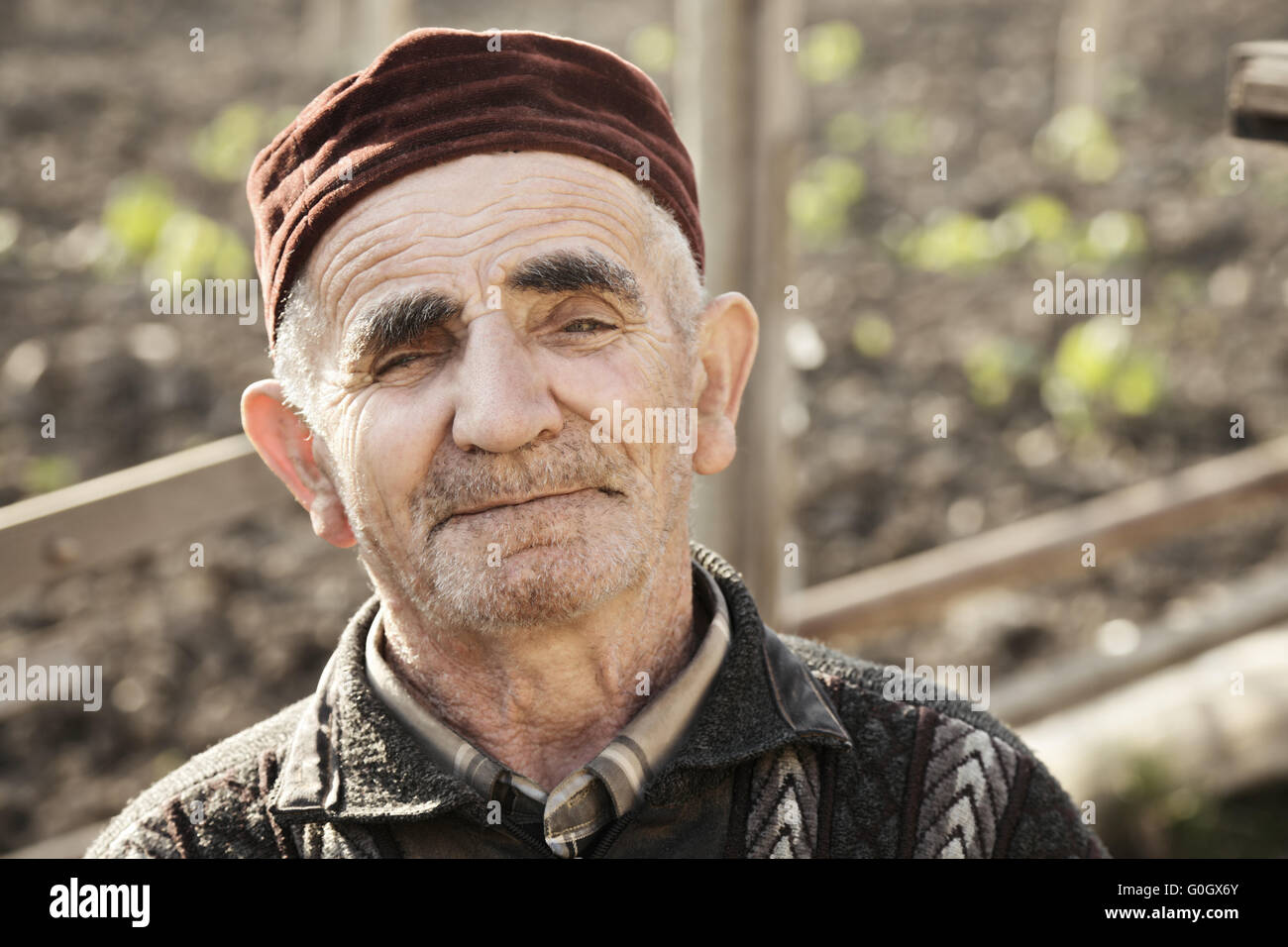 Senior man wearing cap Stock Photo - Alamy
