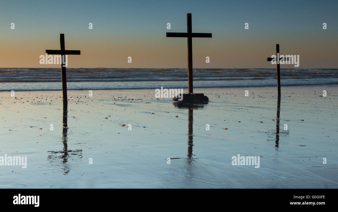 Three crosses at sundown on a wonderful beach Stock Photo - Alamy