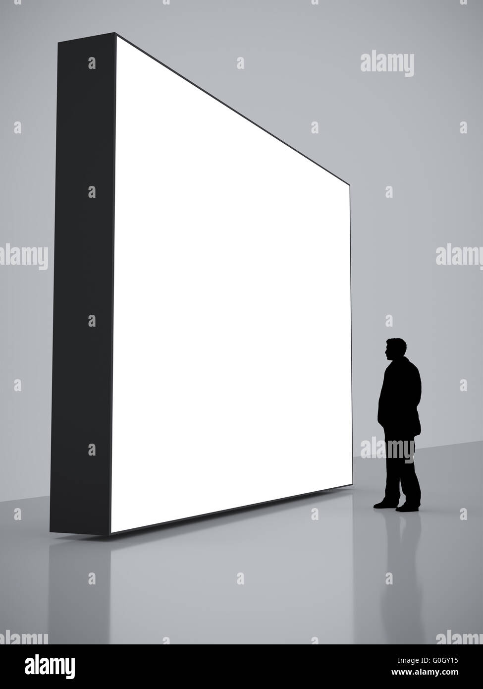 man in front of a big white screen Stock Photo - Alamy