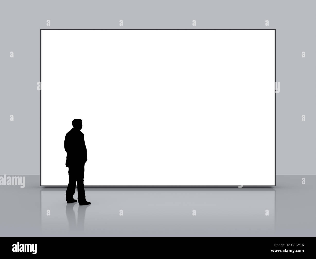 man in front of a big white screen Stock Photo - Alamy