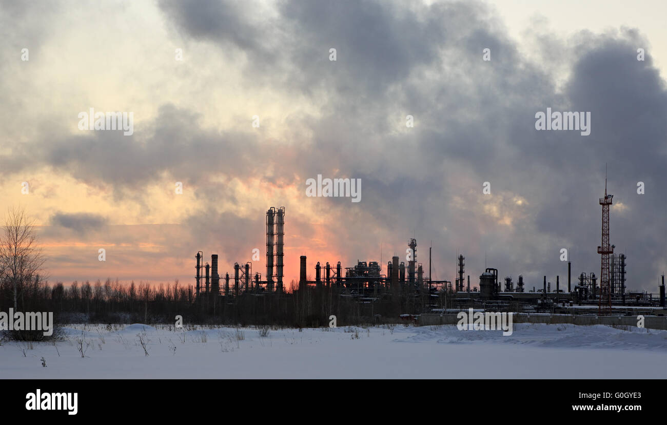 Refinery at sunset sky background. Frosty snowy winter evening Stock ...