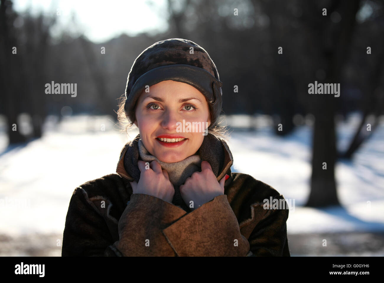 Beautiful girl wearing cap and a buckskin jacket in winter time Stock ...