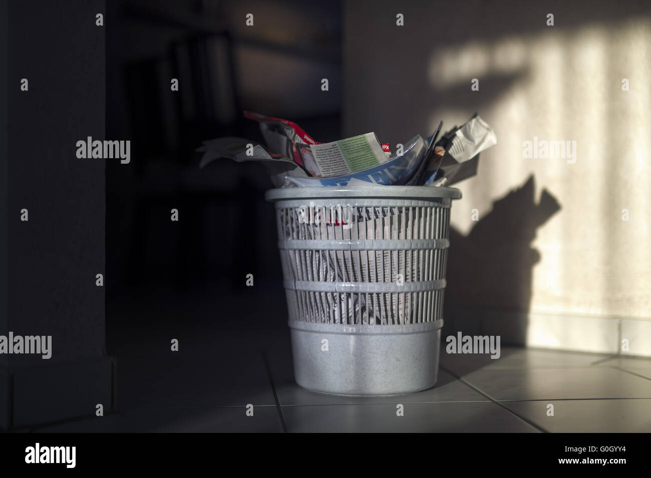 A full trash stands in the hallway in the morning sun Stock Photo - Alamy