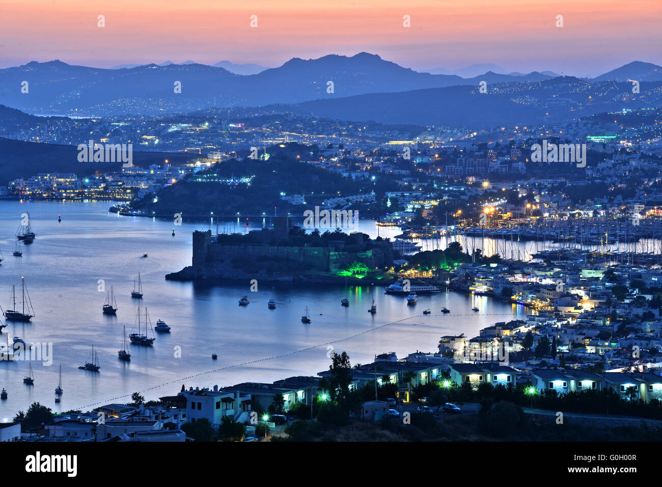 View of Bodrum harbor and Castle of St. Peter by night. Turkish Riviera ...