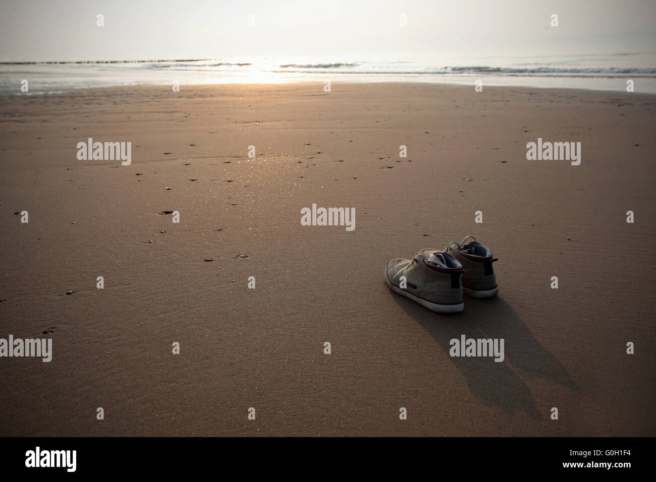 Shoe on the beach hi-res stock photography and images - Alamy