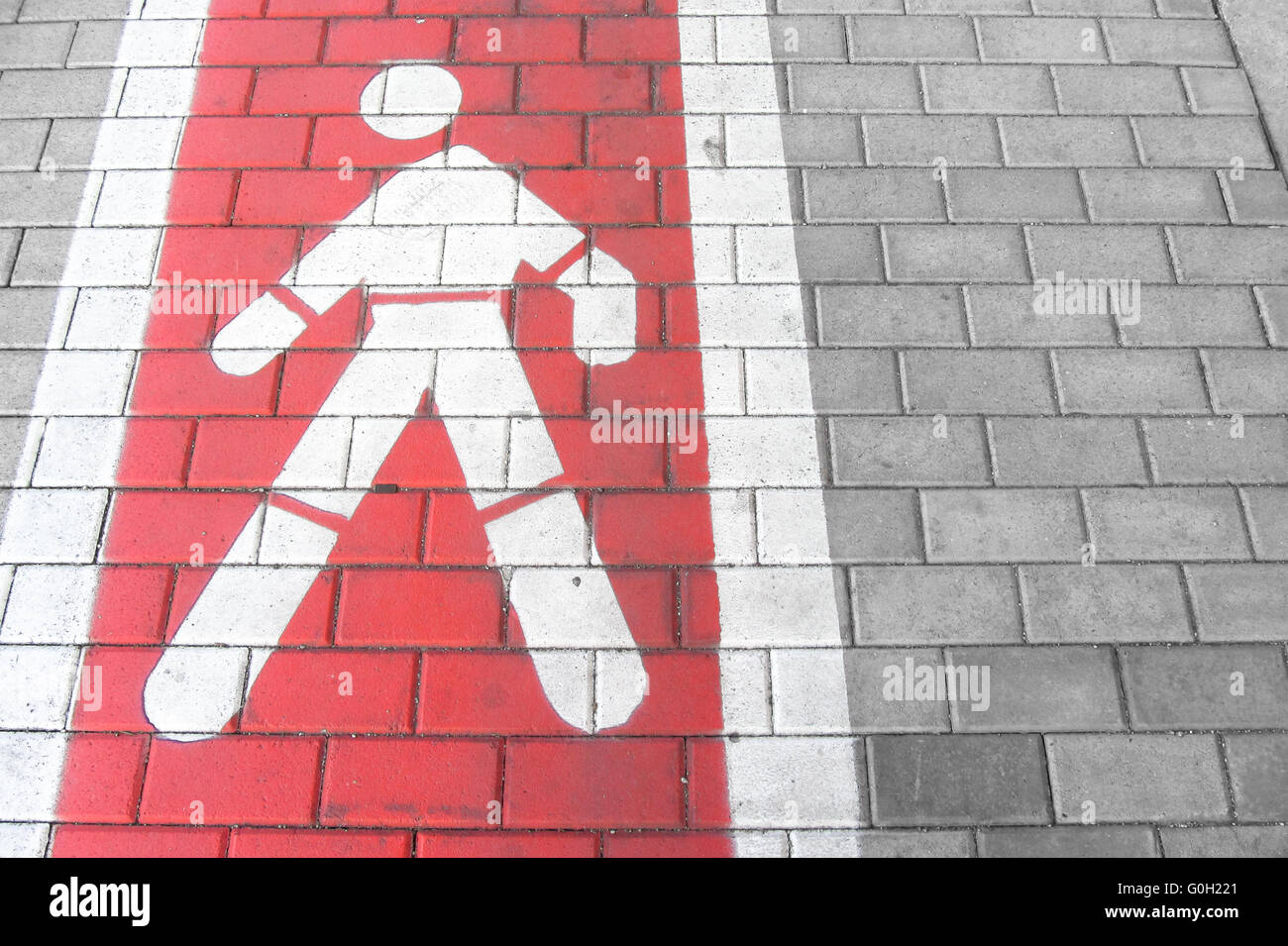 red pedestrians lane along a sidewalk Stock Photo - Alamy