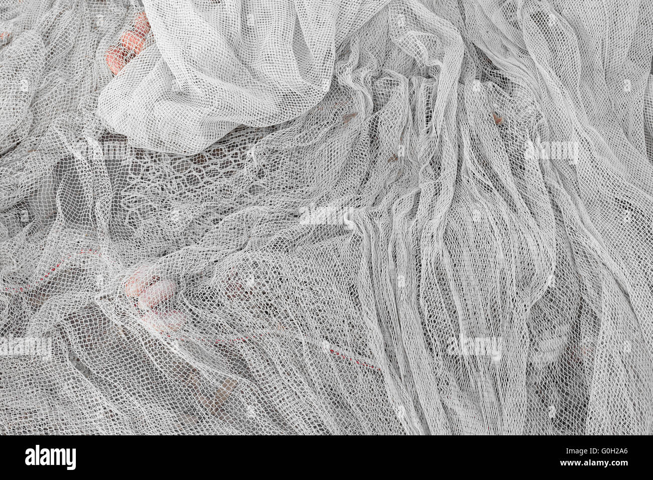 Used fishing net with floaters Stock Photo - Alamy