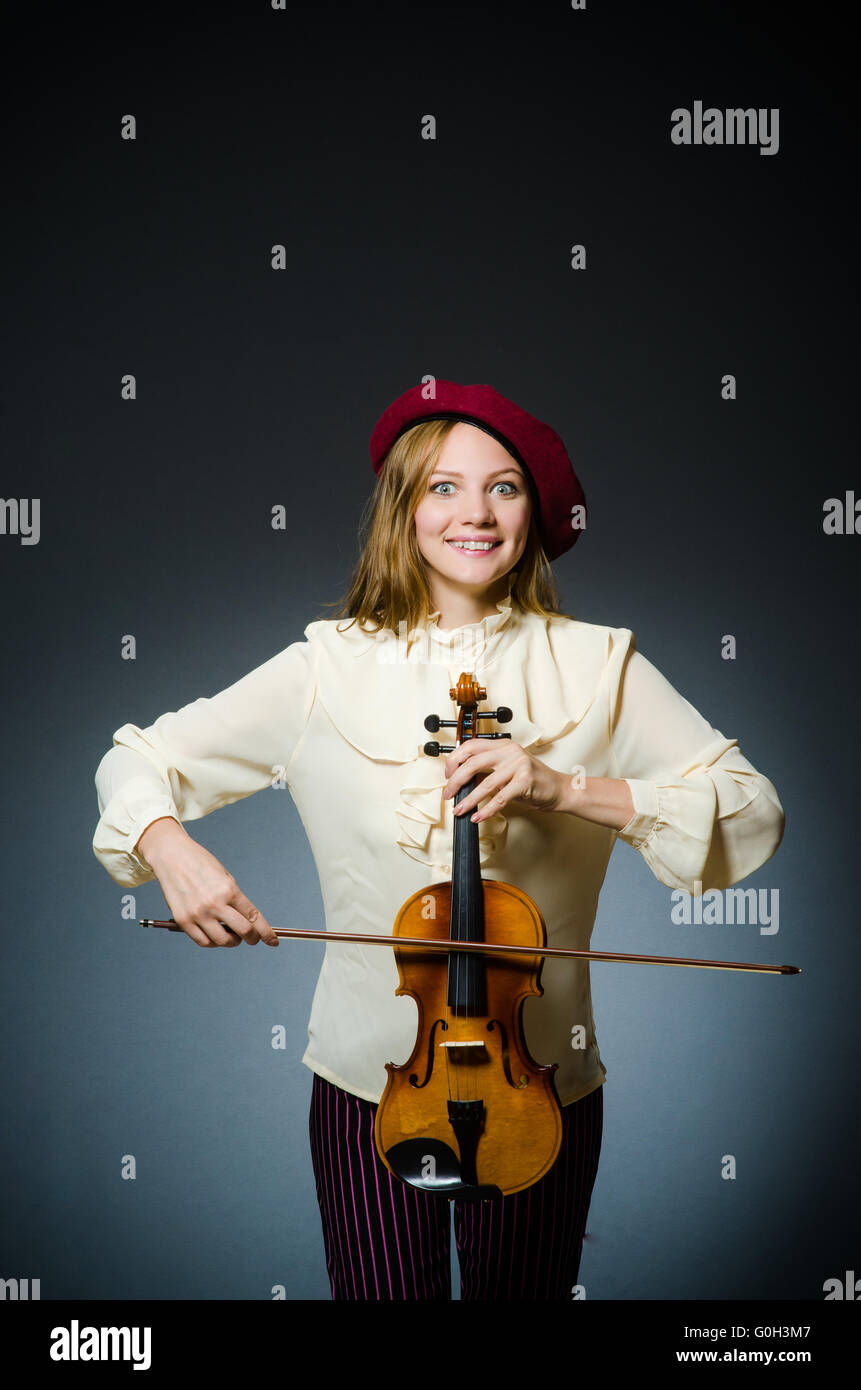 Woman violin player in musical concept Stock Photo - Alamy