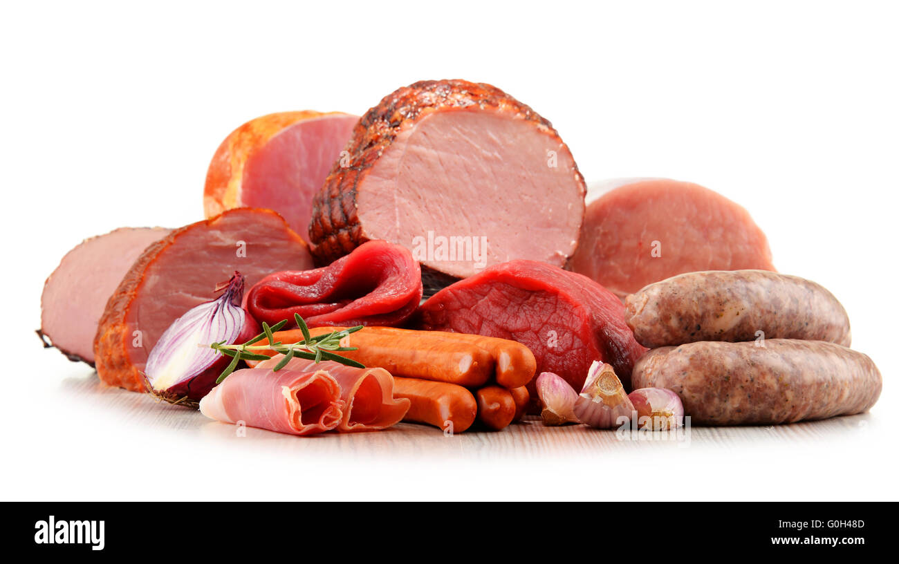 Assorted meat products including ham and sausages isolated on white ...