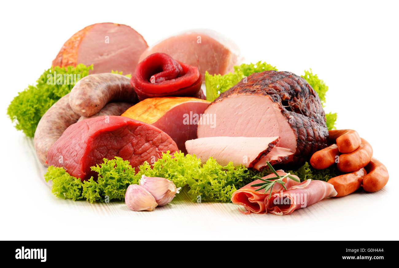 Assorted meat products including ham and sausages isolated on white ...