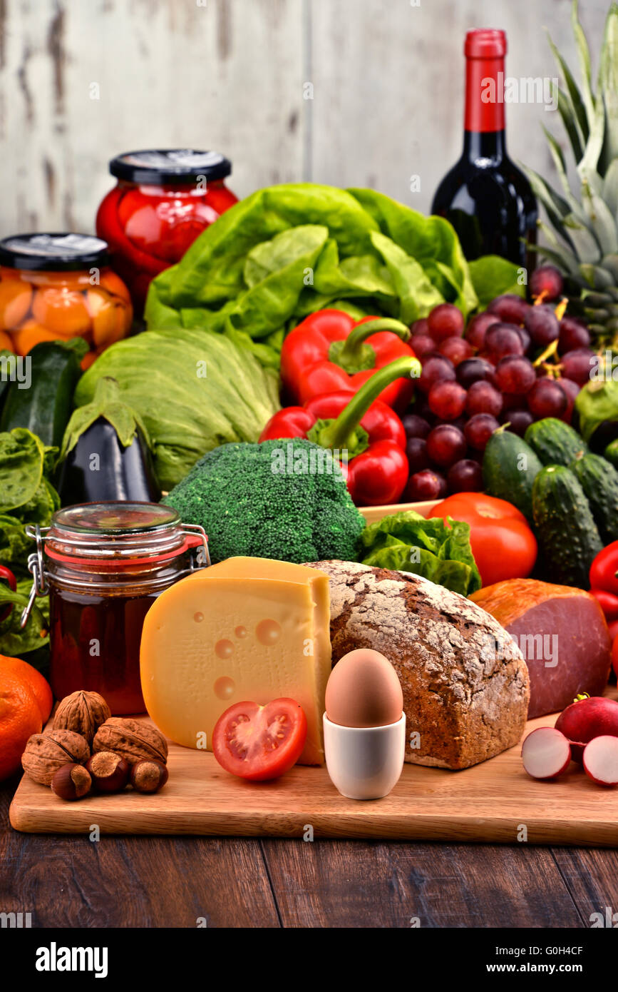 Variety of organic food including vegetables fruit bread dairy and meat ...