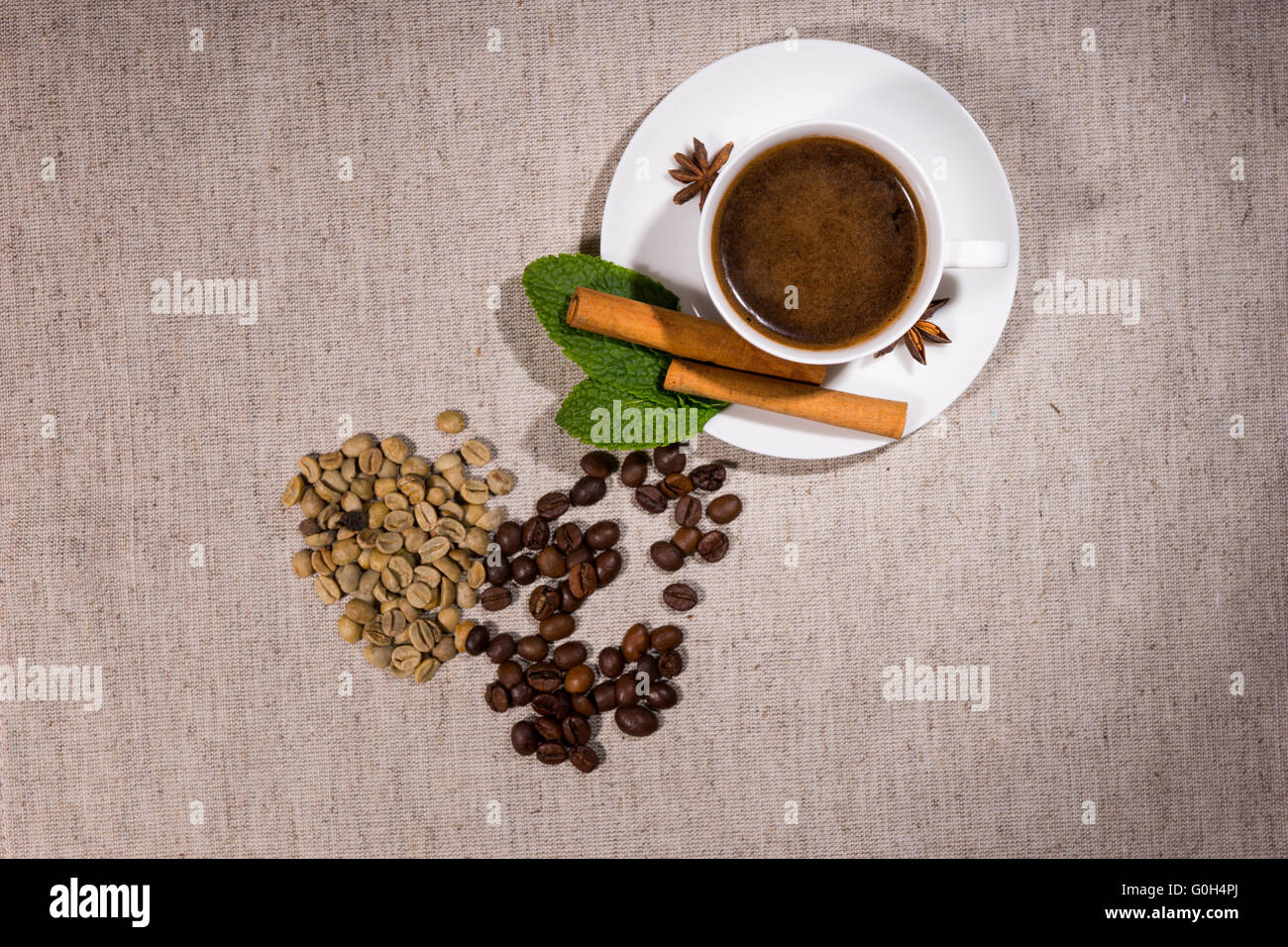 Top down view on pile of two types of different java beans and herbs ...