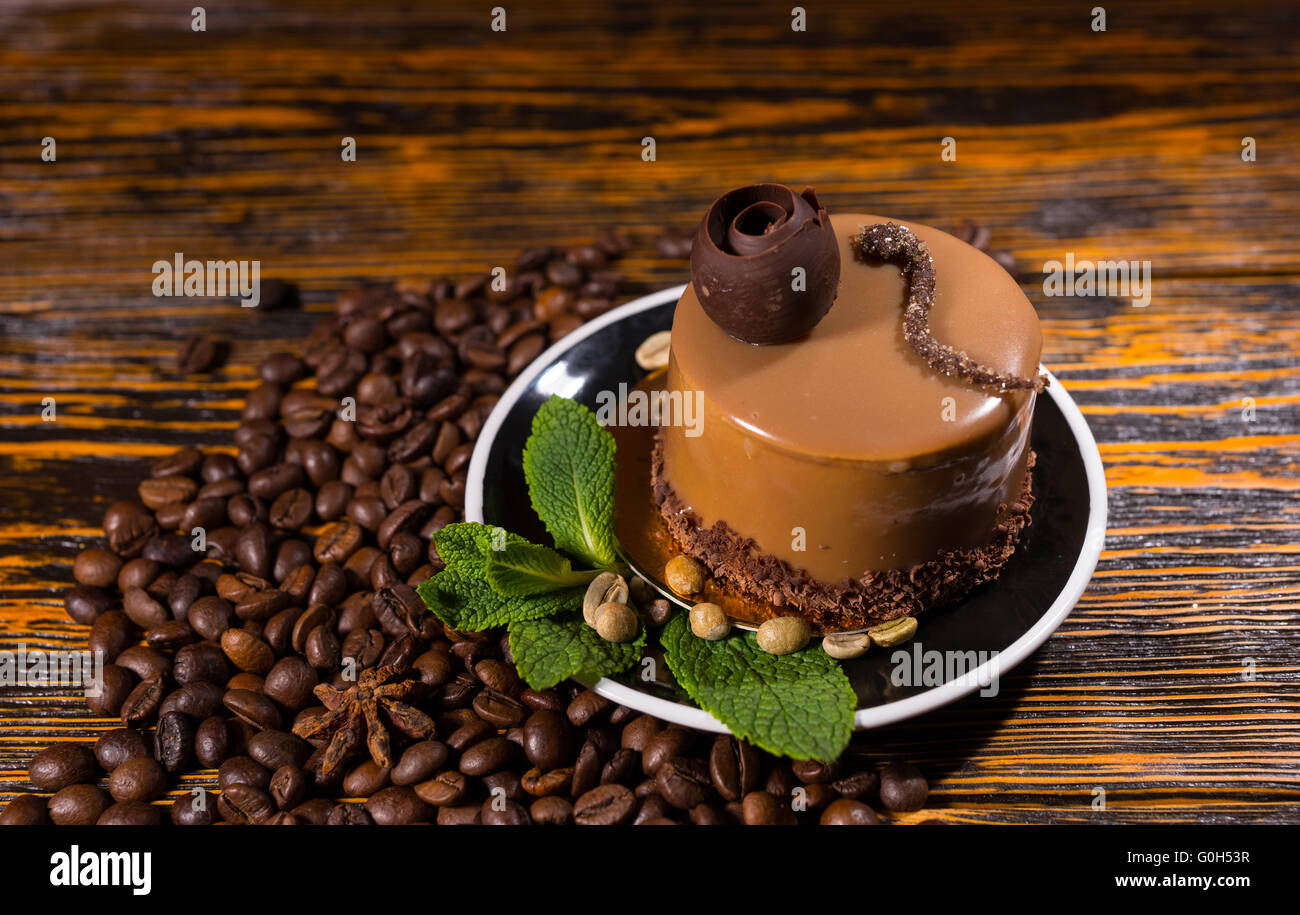 Delicious little cylinder shaped chocolate cake slice in plate ...