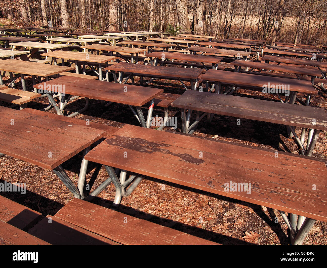 picnic tables stored outside in a park Stock Photo - Alamy