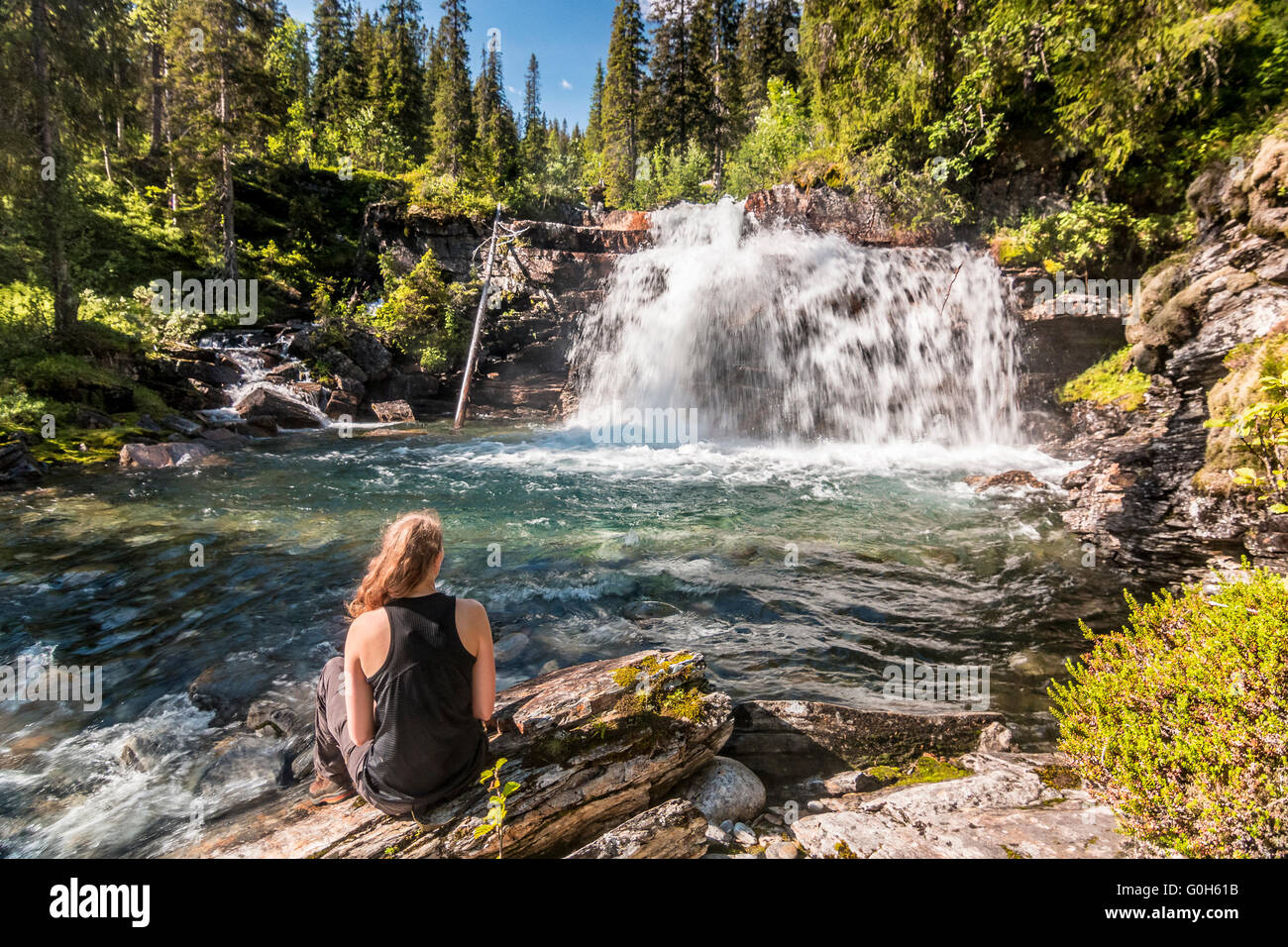 Woman at a waterfall hi-res stock photography and images - Alamy