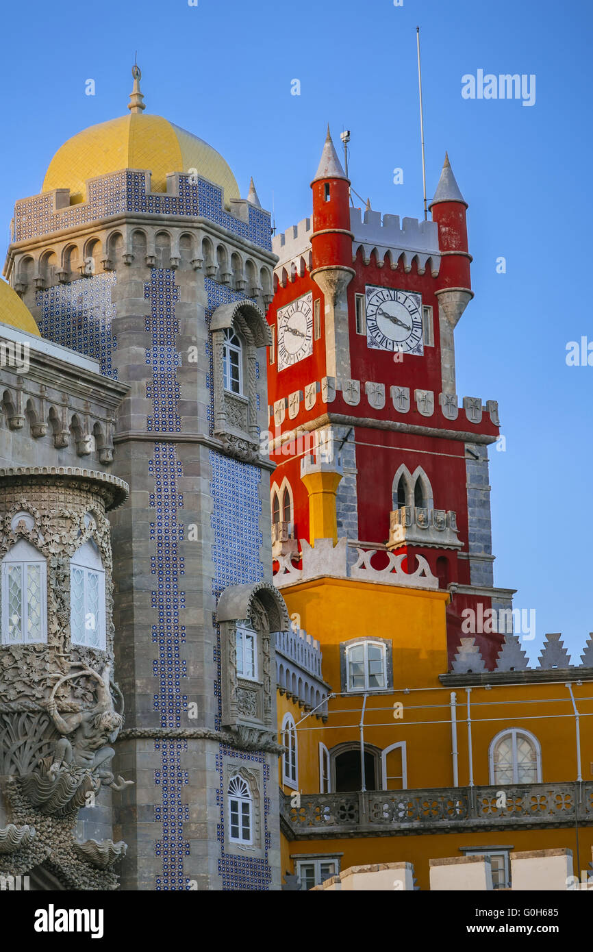 Pena castle red clock tower and blue mosaic towers in Sintra Stock ...