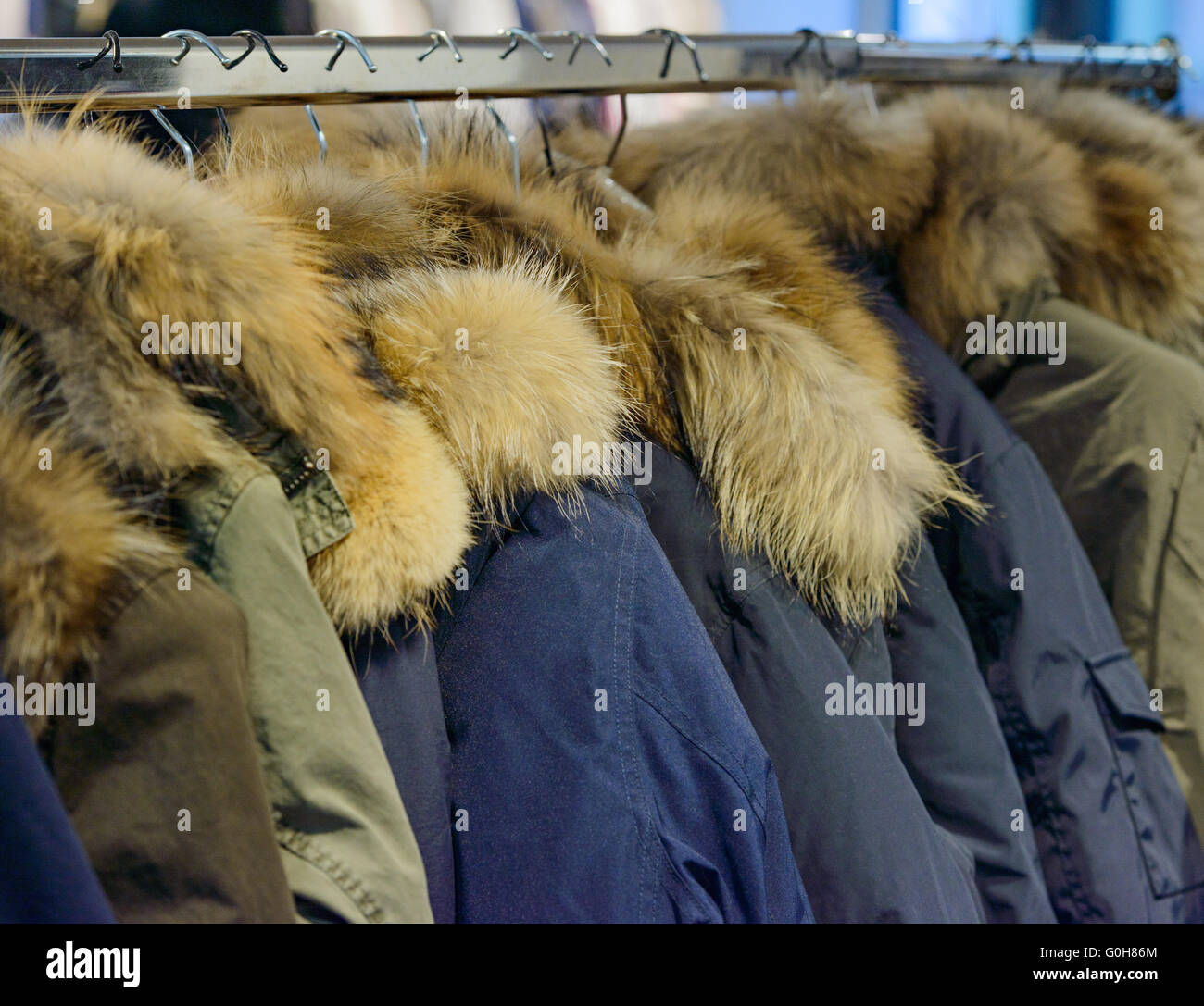 Winter jacket for winter sale on a coat rack Stock Photo - Alamy