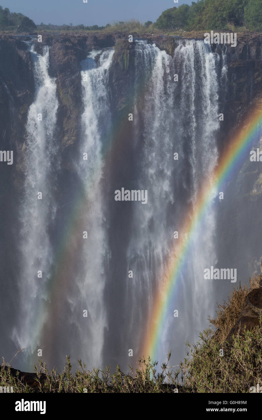 Victoria Falls in October with rainbow crossing. Waterfall running at ...