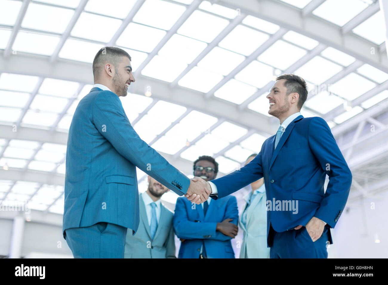 Multi handshake hi-res stock photography and images - Alamy