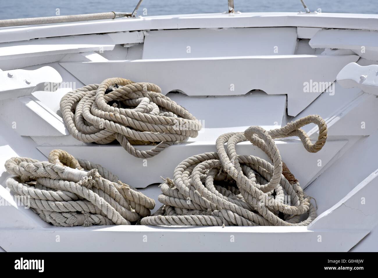 Heavy rope on the front of a boat Stock Photo - Alamy