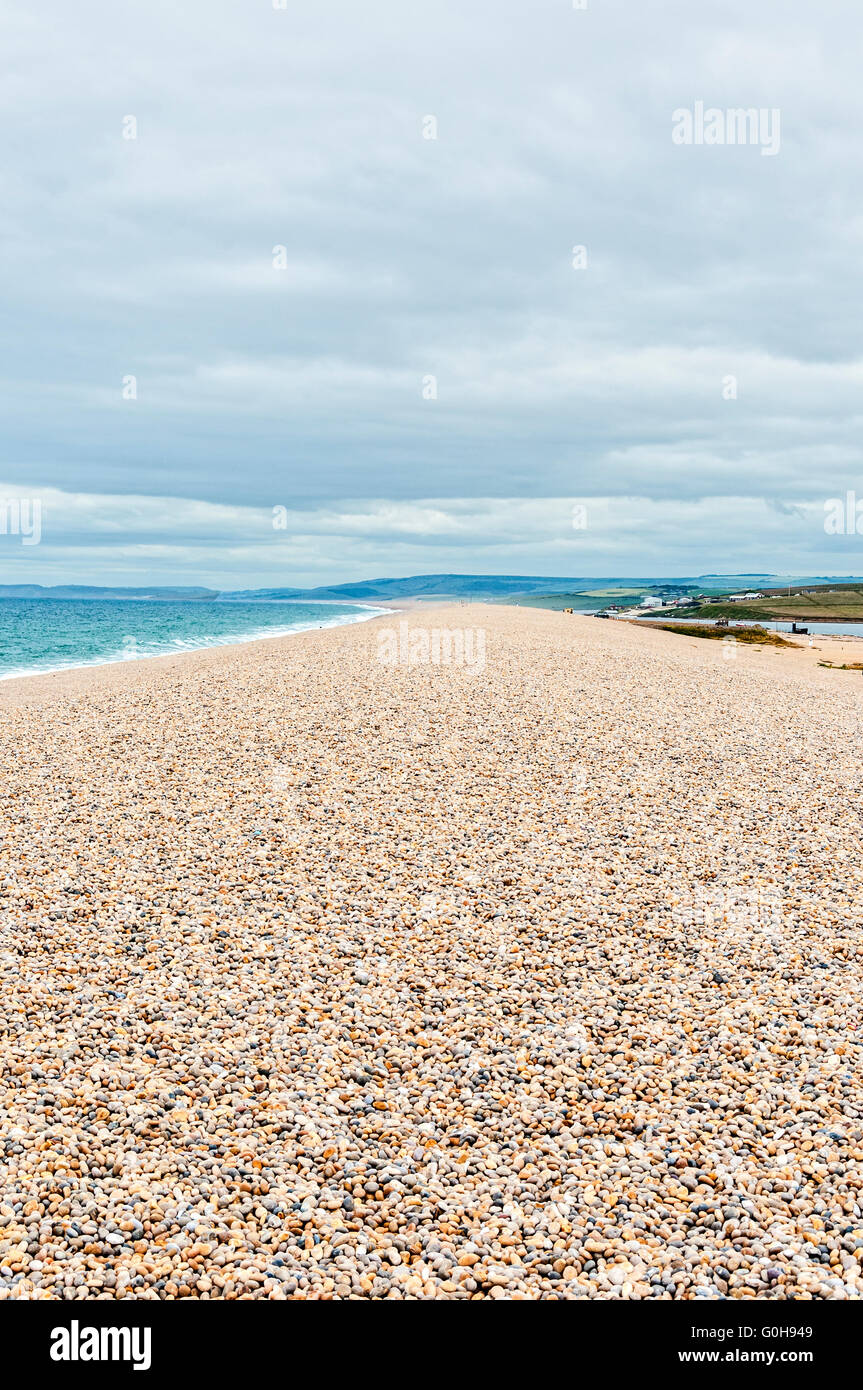 A broad ribbon of coloured flint and chert pebbles stretches into the ...