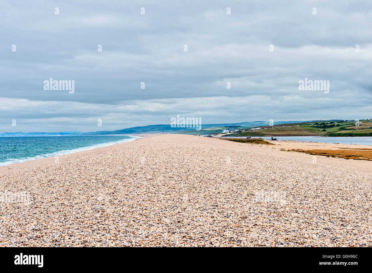 A broad ribbon of coloured flint and chert pebbles stretches into the ...