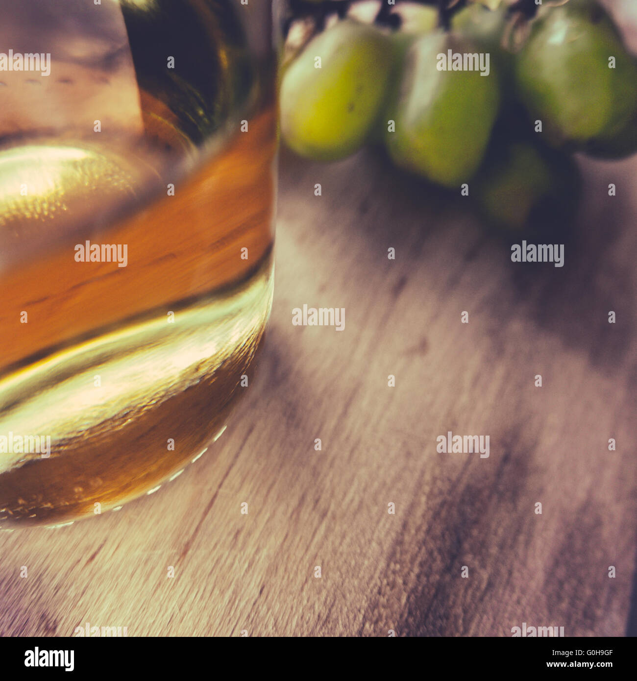 Bottle Of White Wine And Grapes Stock Photo - Alamy
