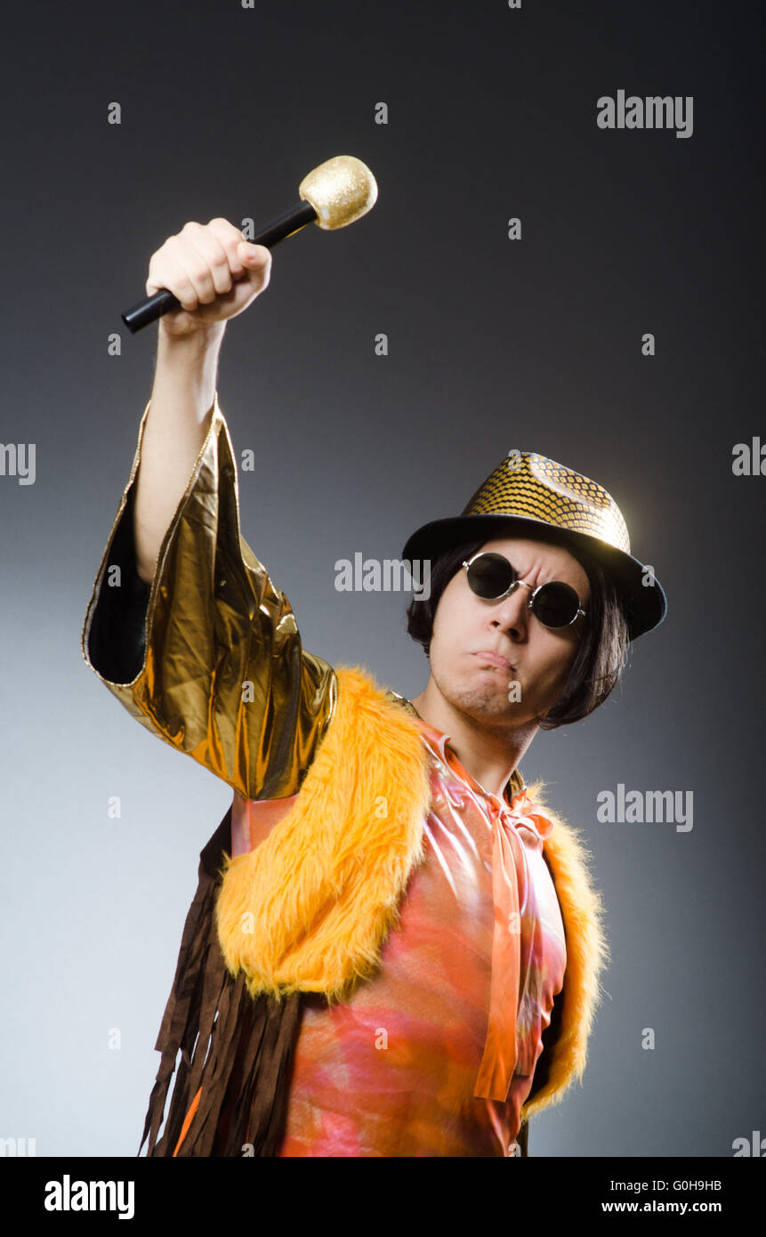 Young man singing in karaoke club Stock Photo - Alamy