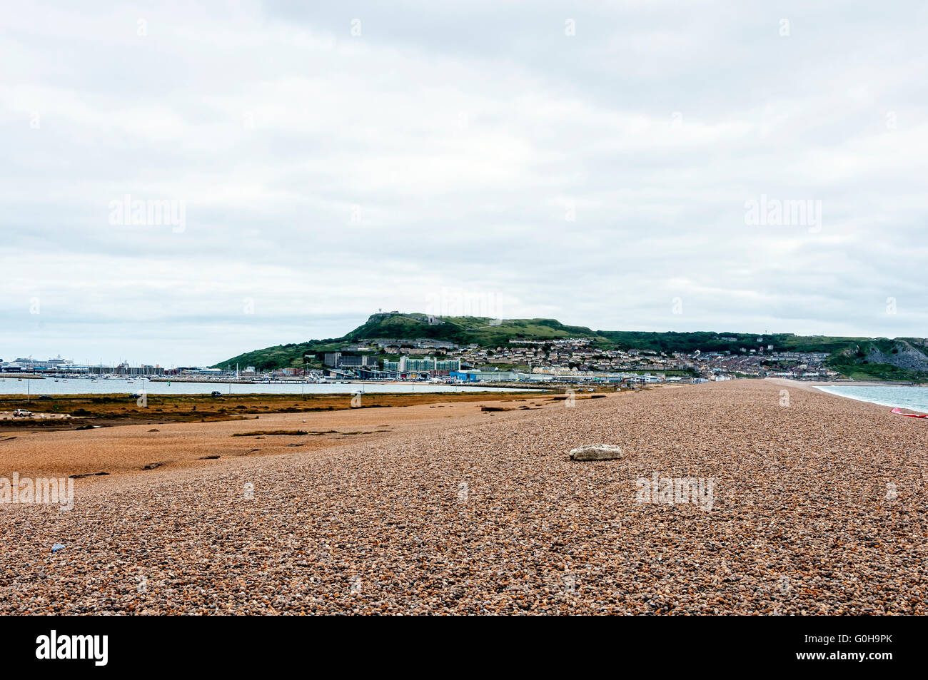A broad ribbon of coloured flint and chert pebbles stretches into the ...