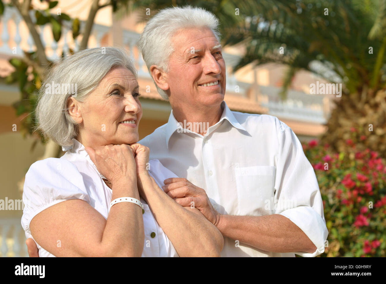 elderly couple rest at tropical resort Stock Photo - Alamy