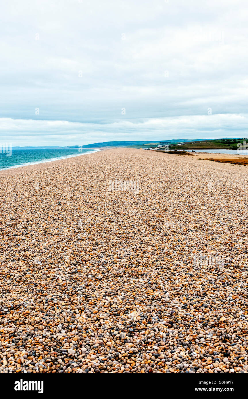 A broad ribbon of coloured flint and chert pebbles stretches into the ...