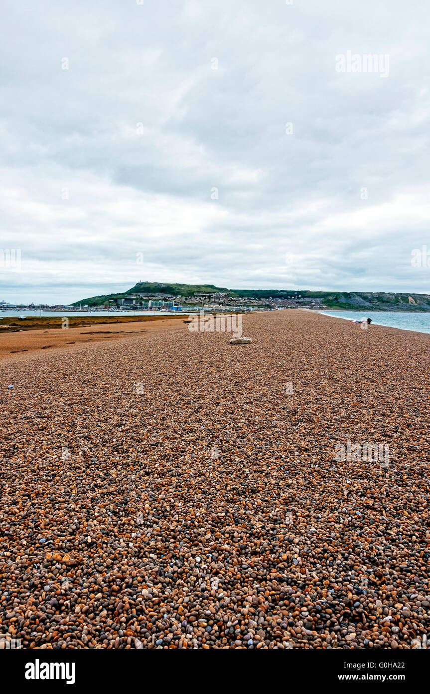 A broad ribbon of coloured flint and chert pebbles stretches into the ...