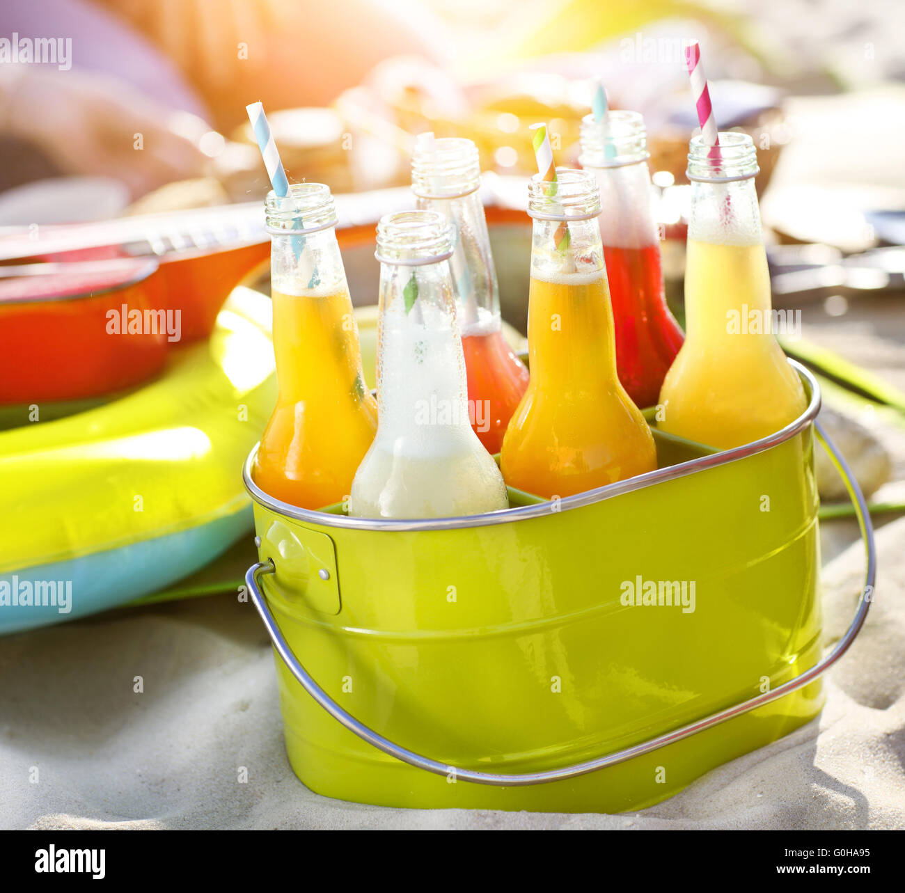 Bottles of lemonade standing in green bucket Stock Photo - Alamy