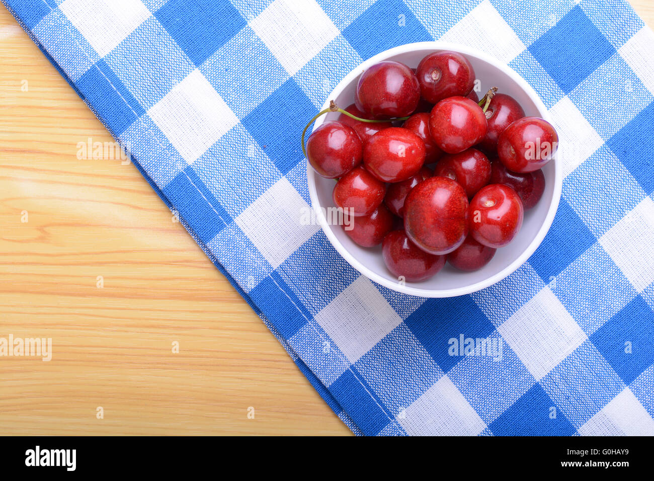 Red ripe cherries in a white bowl Stock Photo - Alamy