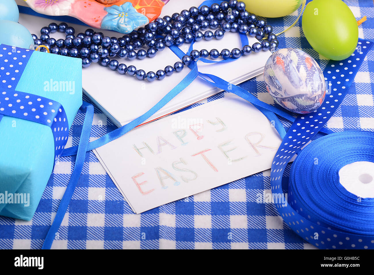 Easter eggs and invitation note. happy easter Stock Photo - Alamy