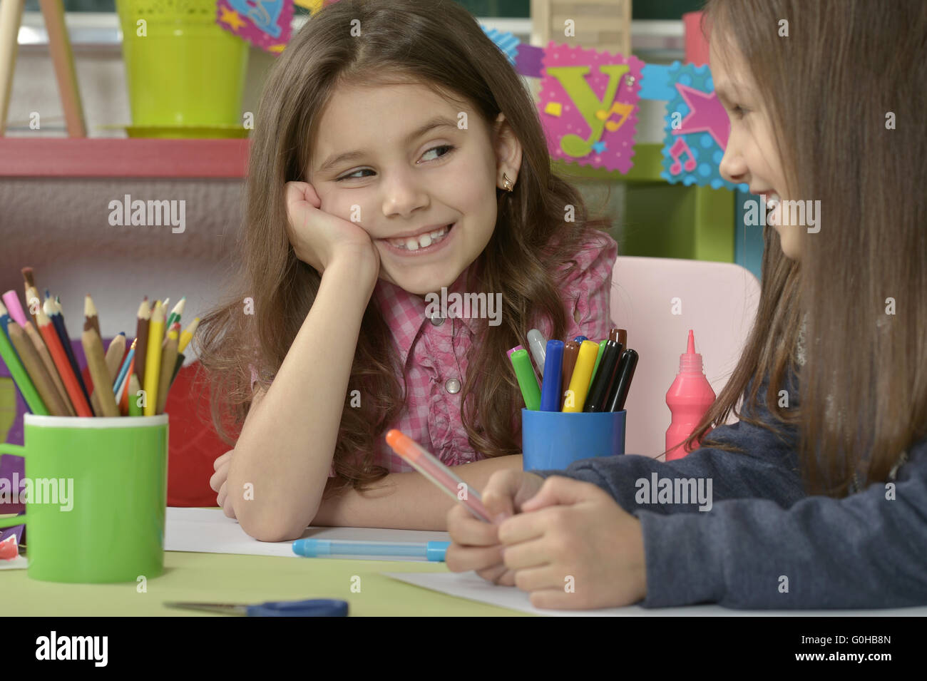 girls drawing with colorful pencils Stock Photo - Alamy
