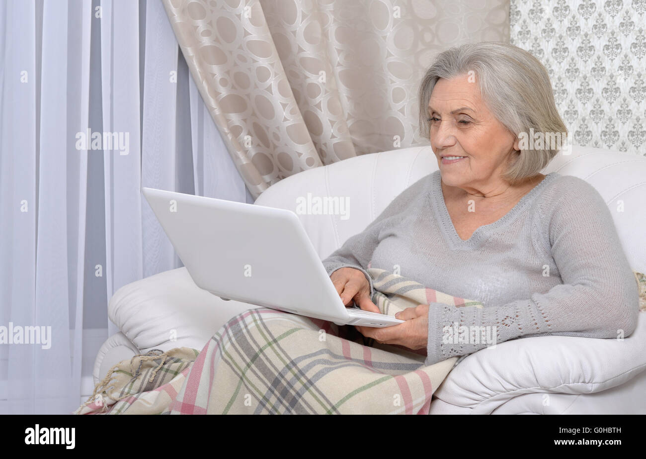 Elderly woman with laptop Stock Photo - Alamy