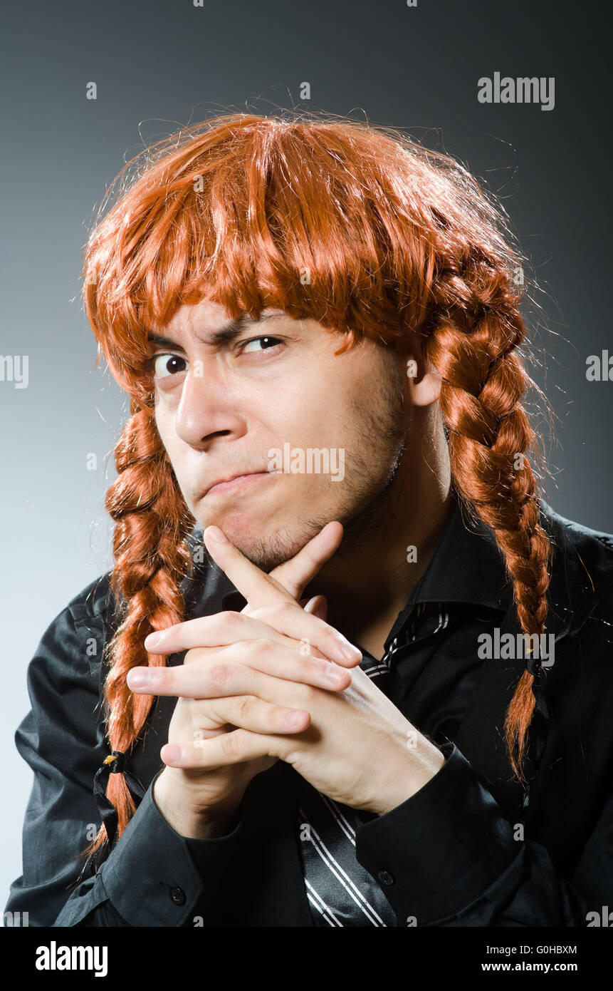Funny man with red hair wig Stock Photo - Alamy