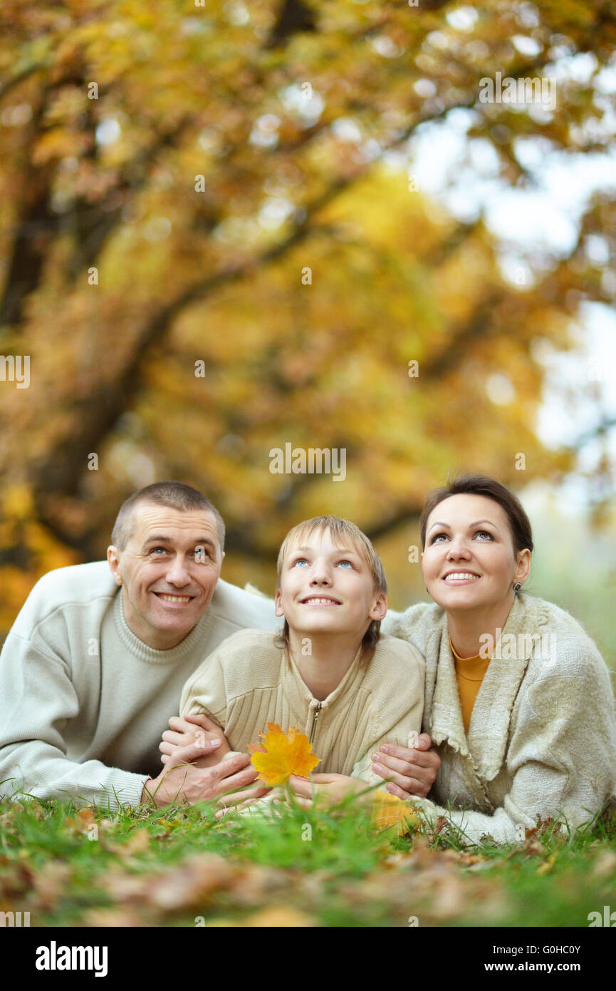 Family in autumn park Stock Photo - Alamy