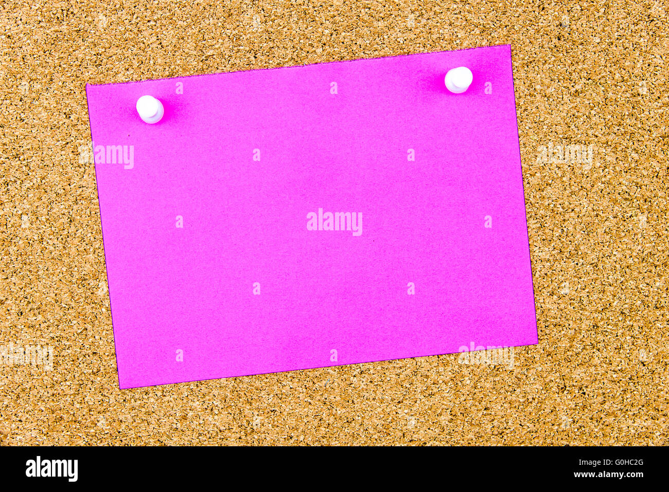 Blank paper note pinned on cork board with thumbtacks, copy space ...
