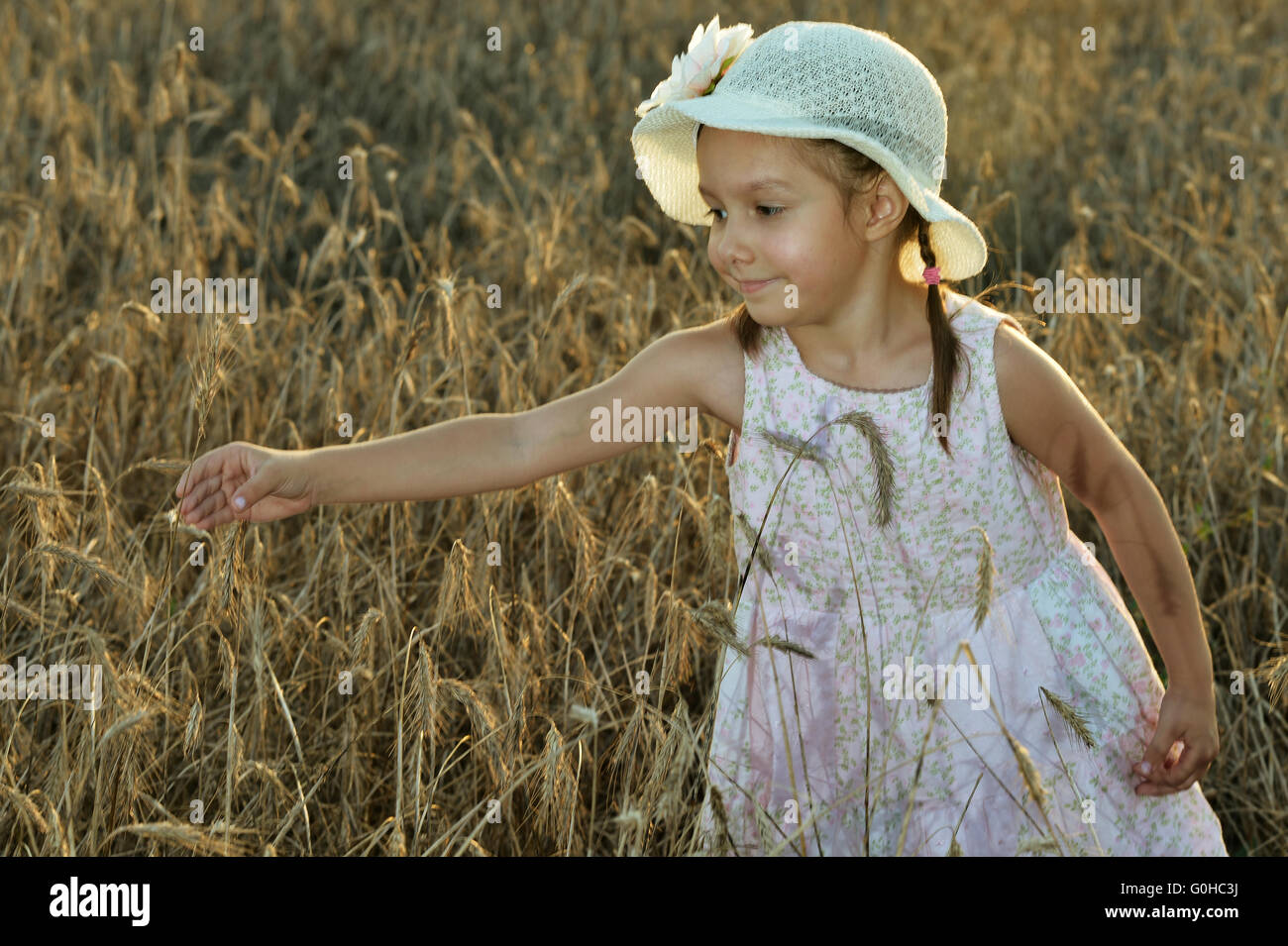 Cute little standing girl Stock Photo - Alamy