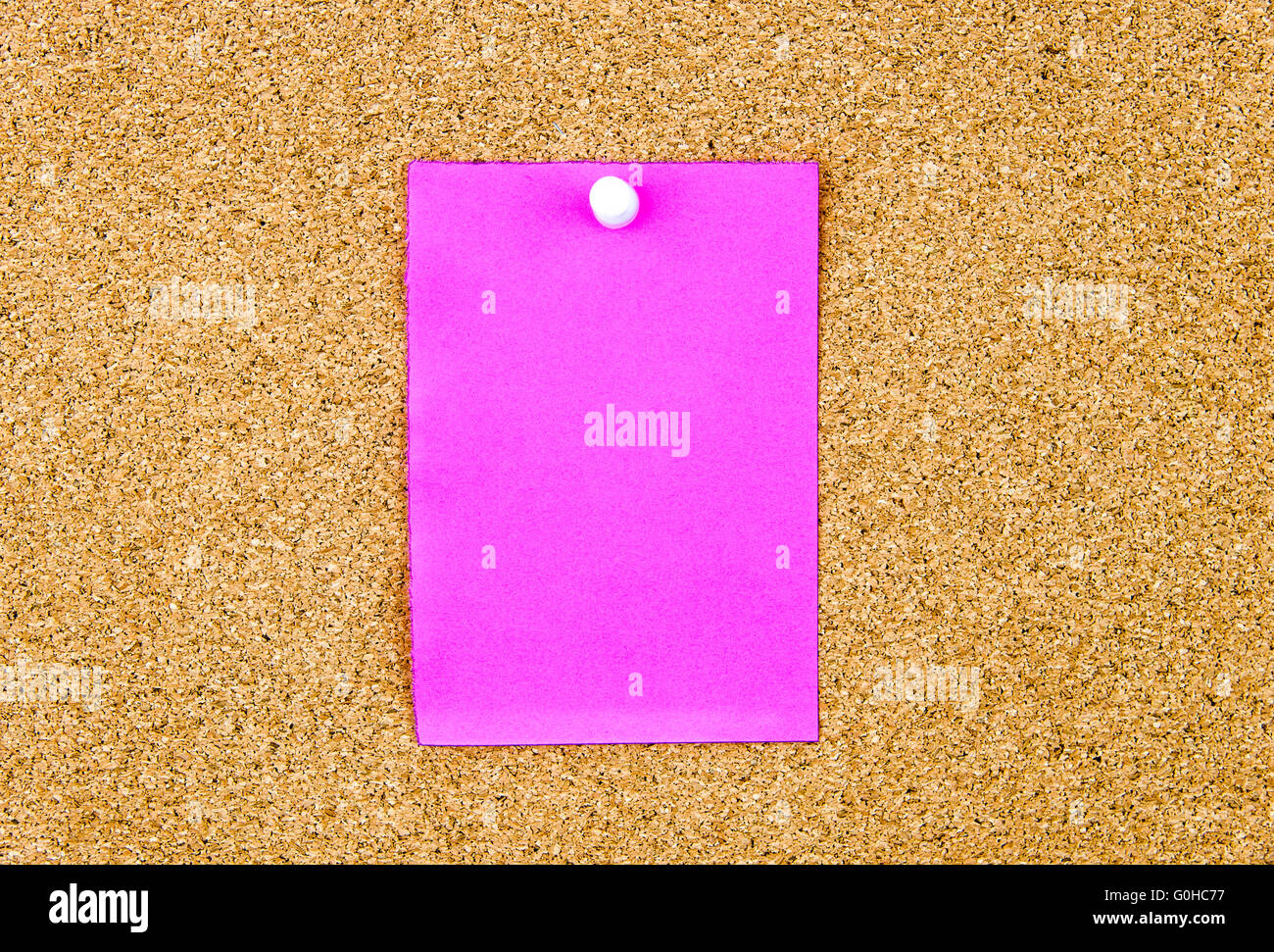 Blank paper note pinned on cork board with thumbtack, copy space ...